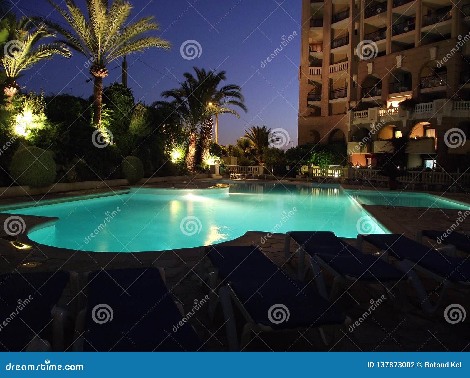 Green pool in the night stock photo. Image of hotel - 137873002