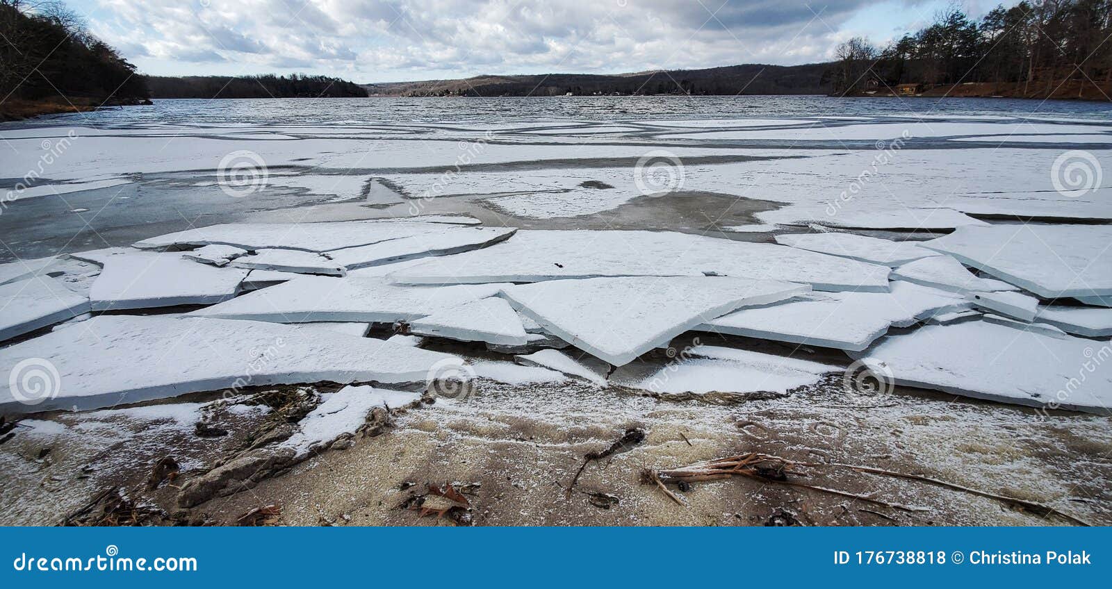 Ice breaking on lake shore stock photo. Image of beach - 176738818