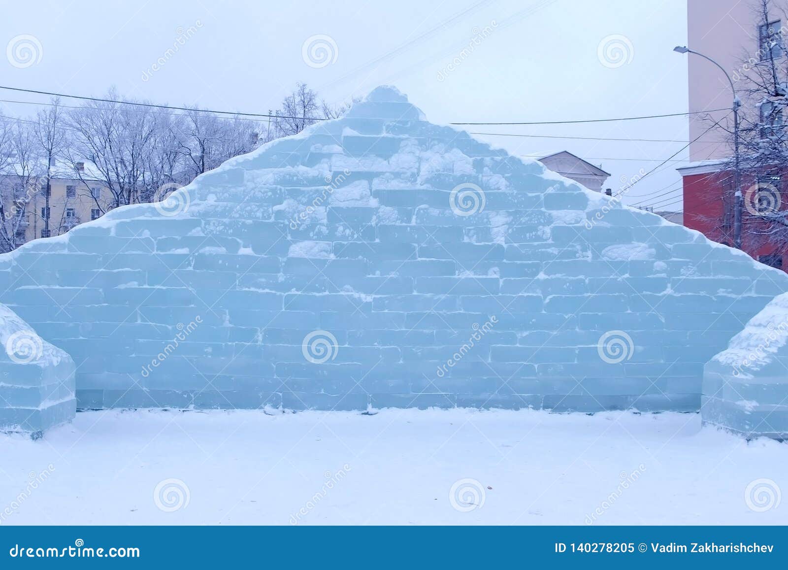 Ice Brick Wall in the Town Square. Decoration with Ice Figures for the ...