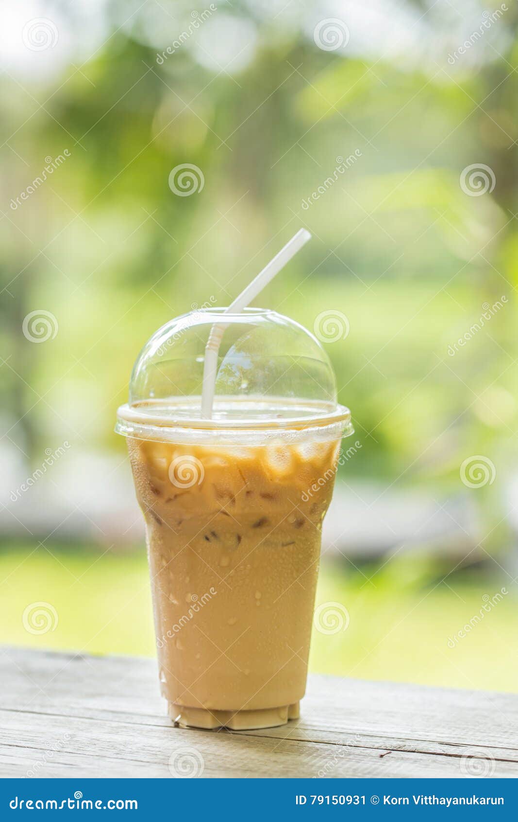 Ice coffee on wood table stock image. Image of close - 79150931