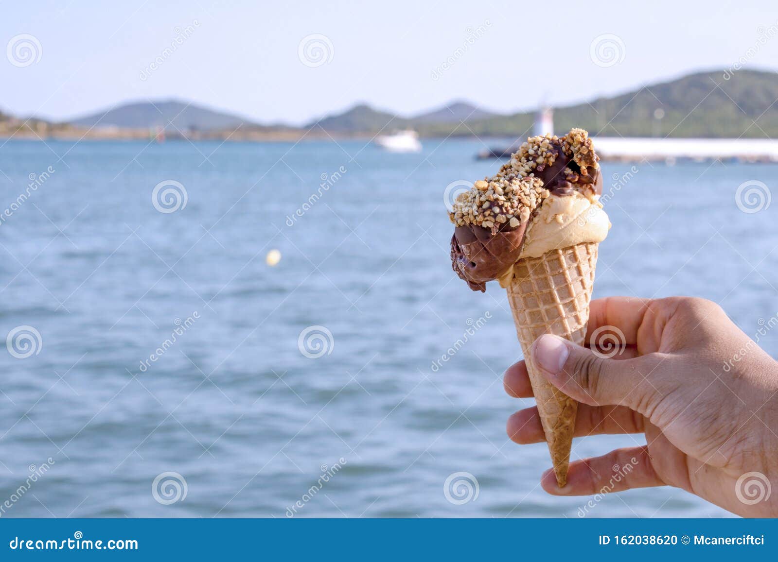 Ice Cream with Caramel and Cocoa. the Sea and Harbor are Also Visible ...