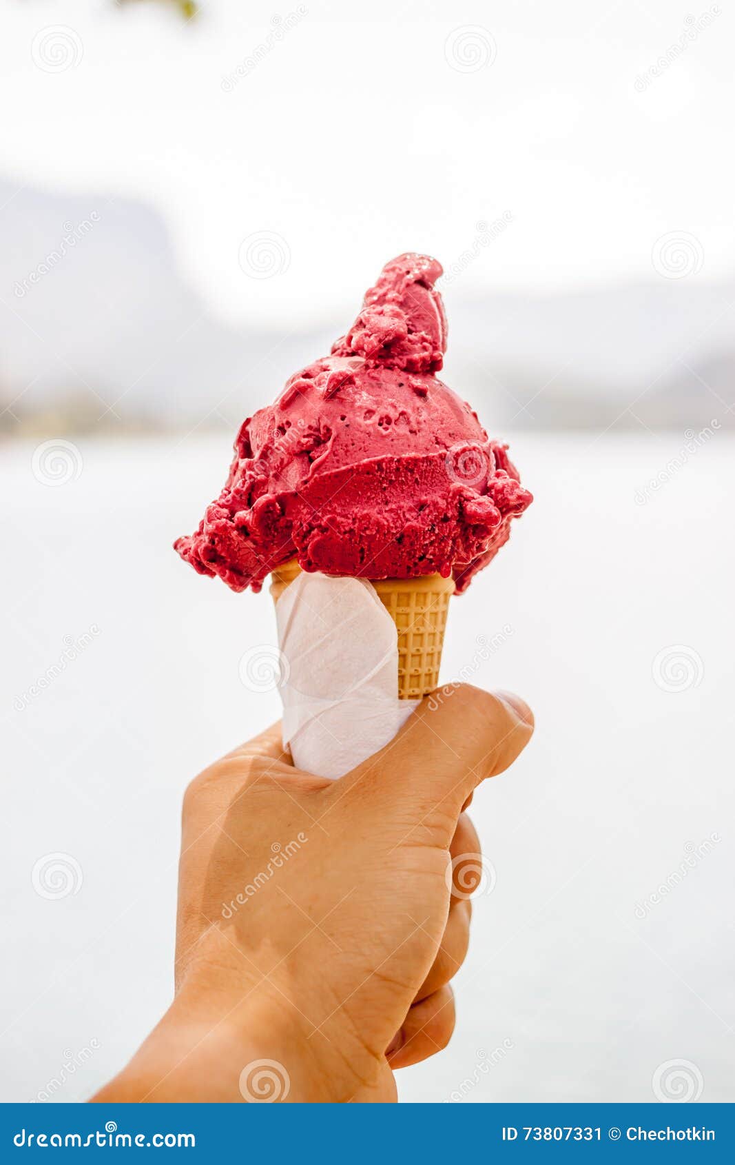 Ice cream cone in the hand stock image. Image of delicious - 73807331