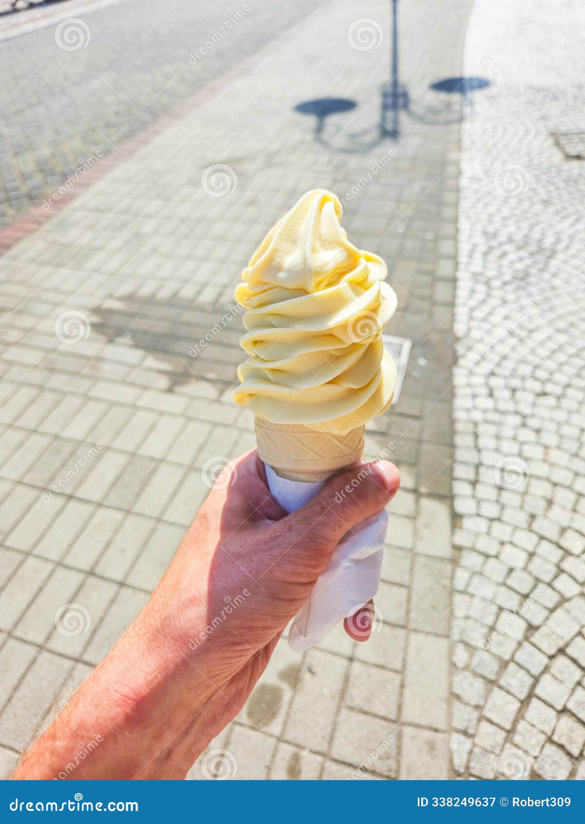 Ice cream cone in man hand stock image. Image of vanilla - 338249637