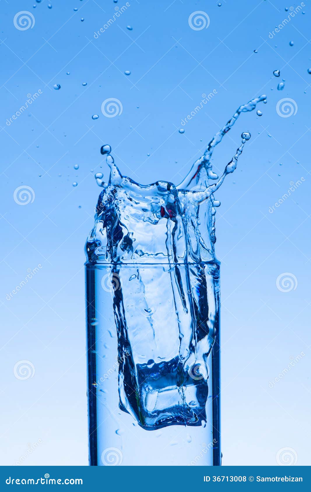 Ice Cube Falls into a Glass of Water Stock Photo - Image of splashing ...