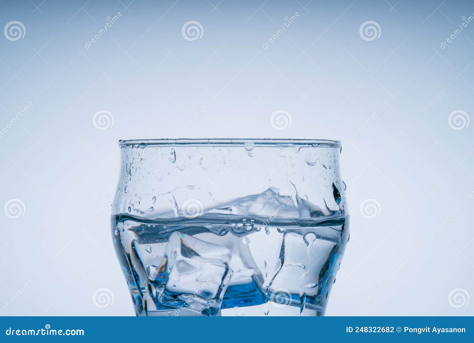 Ice Cube Fell into the Glass of Water. Water Splashed from the Clear ...