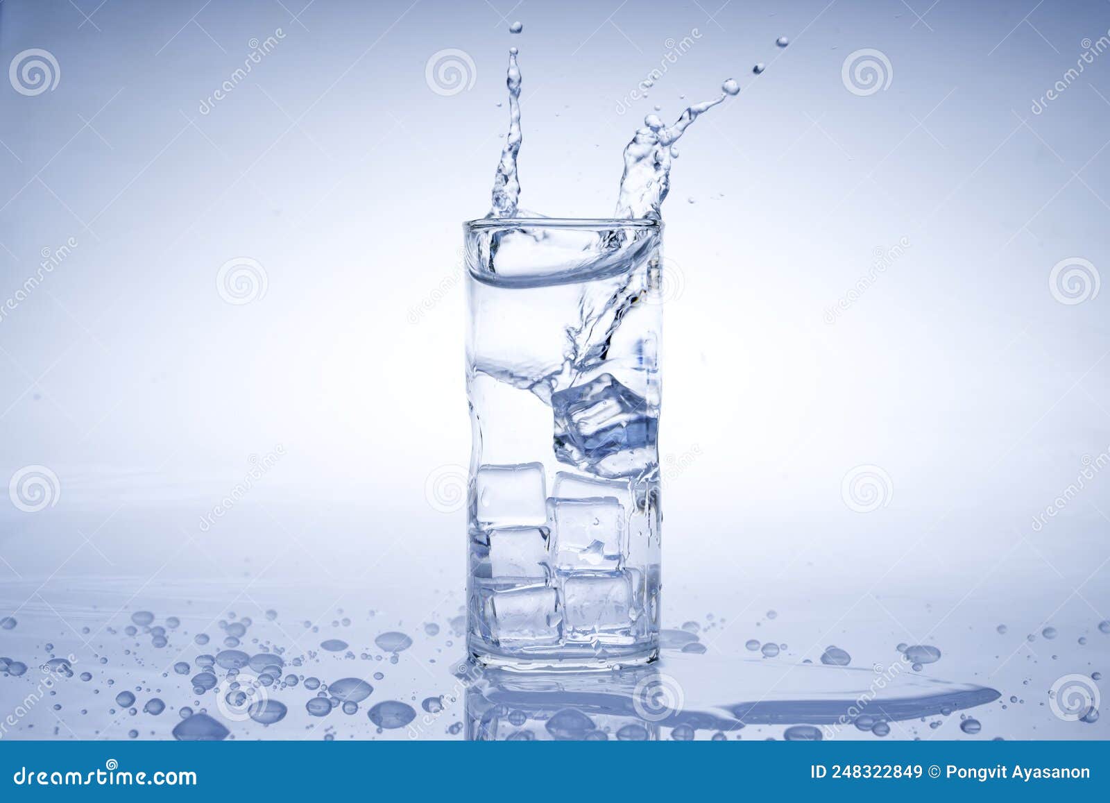 Ice Cube Fell into the Glass of Water.Water Splashed from the Clear ...