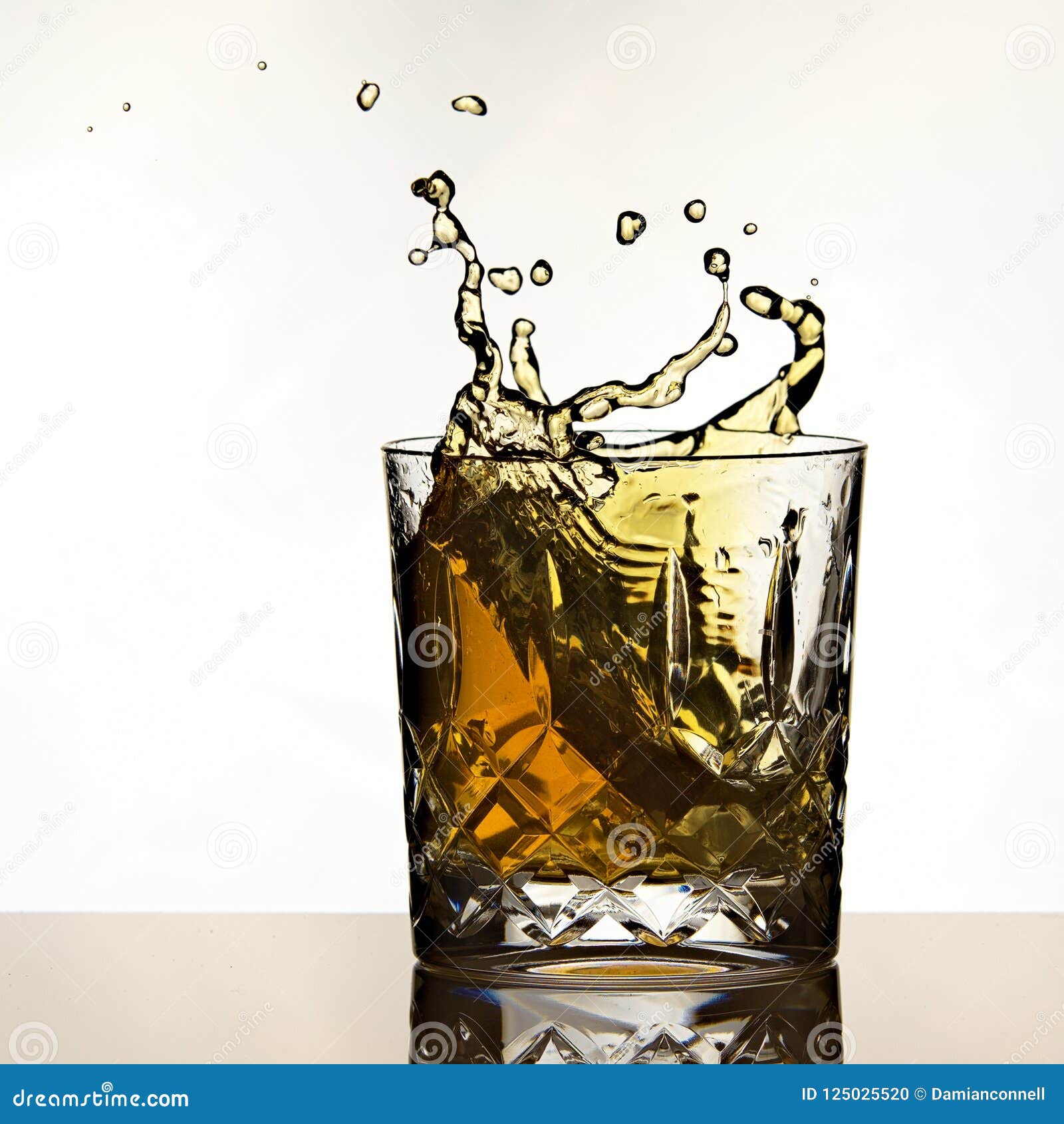 Ice cube splash in whisky stock photo. Image of crystal - 125025520 Ice cube splash in whisky stock photo. Image of crystal - 125025520