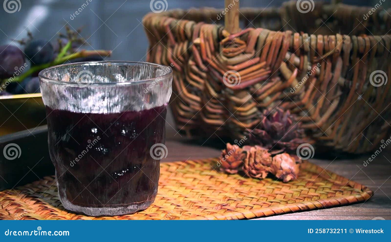 Ice Cube Splashing into the Glass with Grape Juice in the Rustic Cozy ...