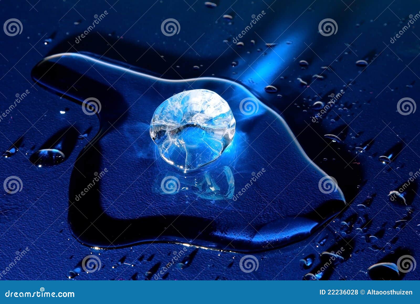 Ice cube in water puddle stock photo. Image of frigid - 22236028