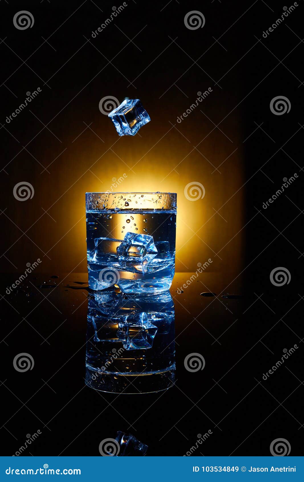 Ice Cube and Water Splash in a Clear Glass. Stock Image - Image of ...