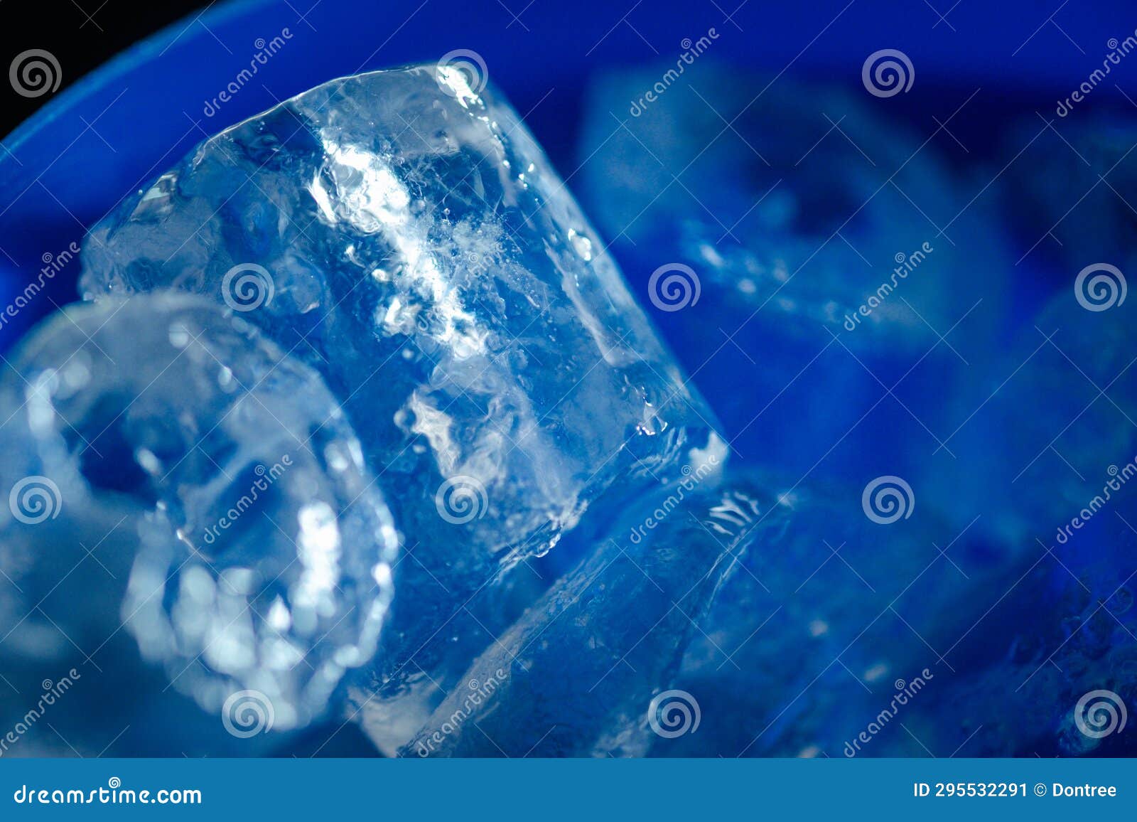 Ice cubes in blue bucket stock image. Image of clean - 295532291
