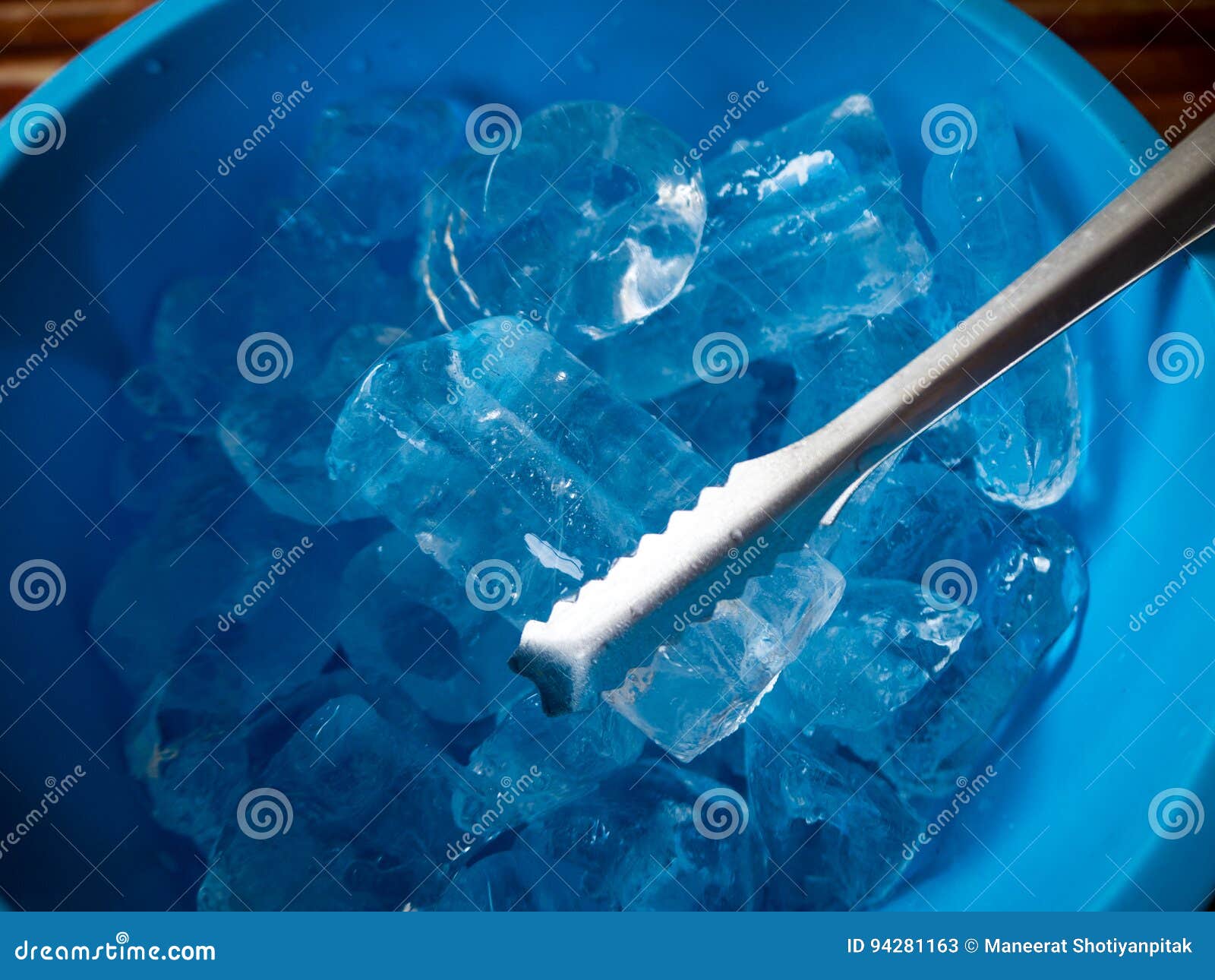 Ice cubes in Blue bucket stock image. Image of clear - 94281163