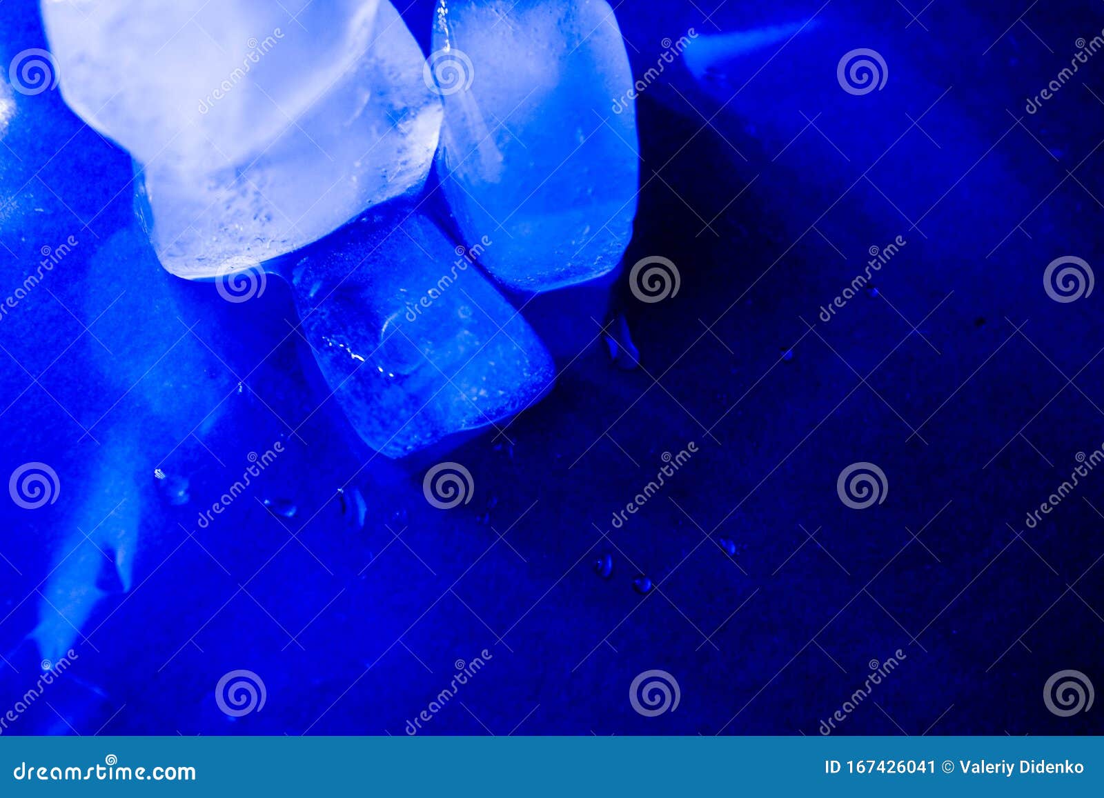 Ice cubes in blue light stock image. Image of object - 167426041