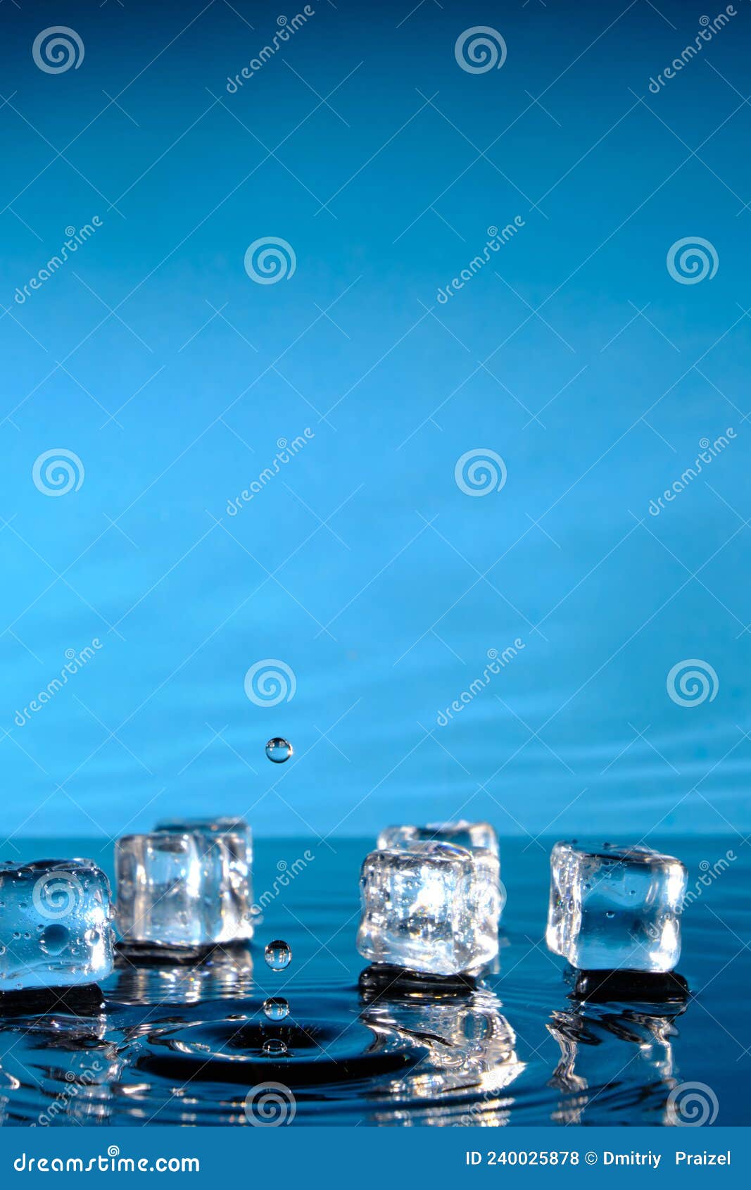 Ice Cubes in Bright Blue Water and a Splash of Raindrops Stock Photo ...