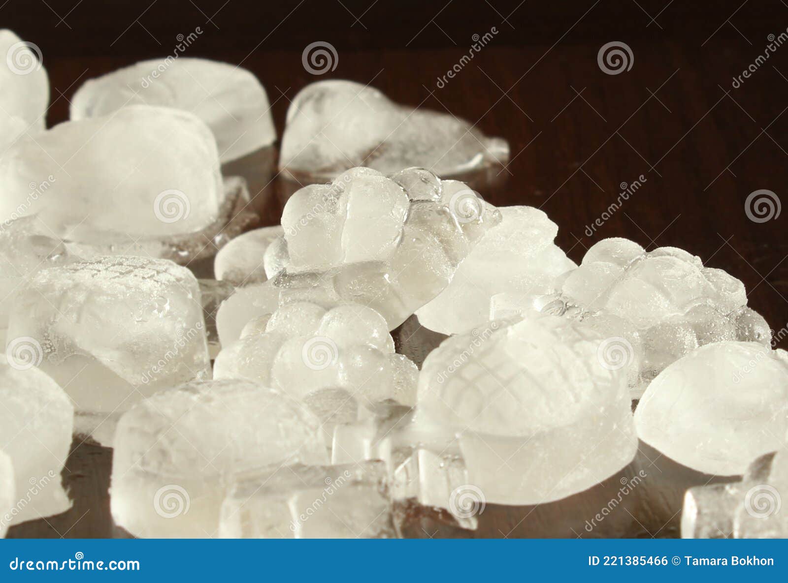 Ice Cubes of Different Shapes on a Dark Wooden Surface. Pineapple ...