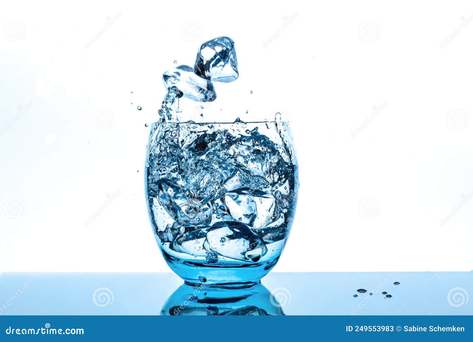 Ice Cubes Fall in a Glas with Fresh Water, Isolated on White Background ...