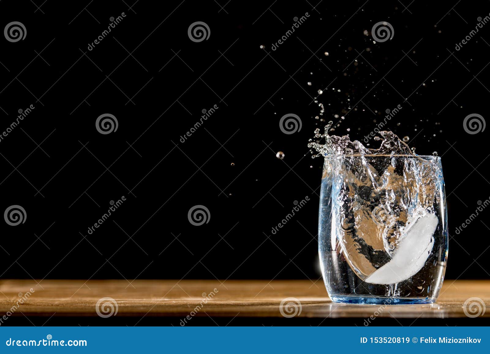 Ice Cubes Falling into Water and Splashing Stock Image - Image of ...