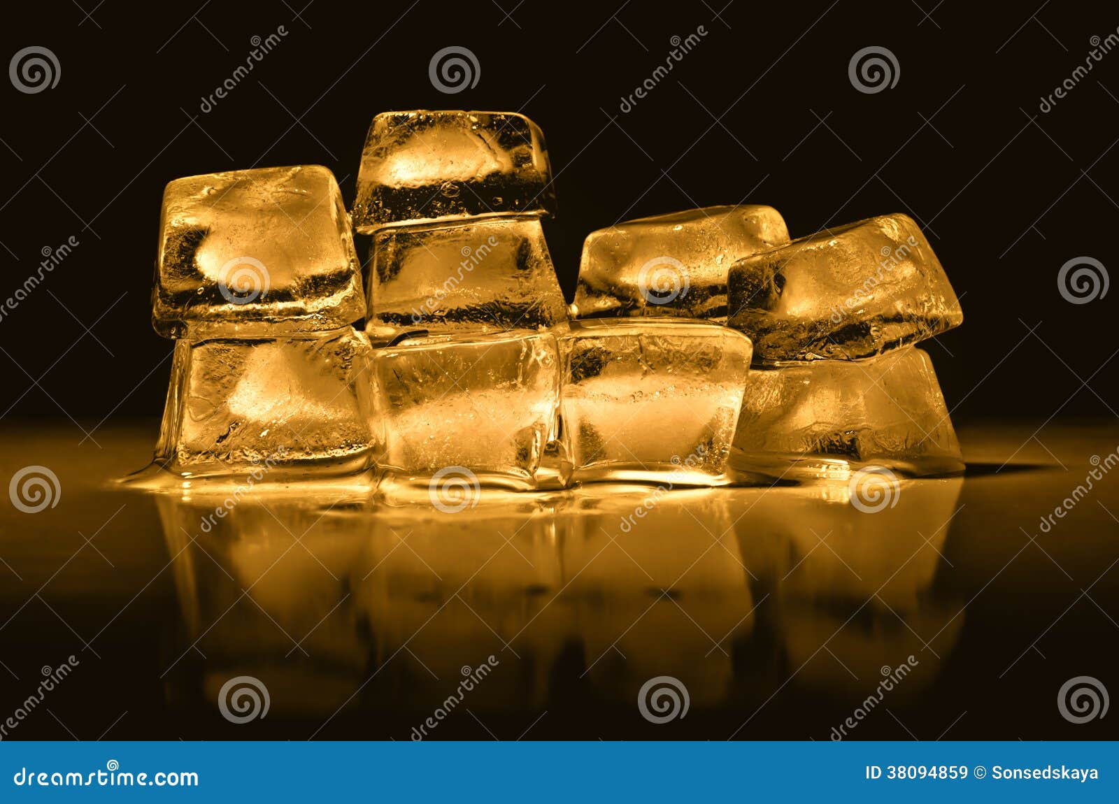 Ice cubes of gold color stock image. Image of drinks - 38094859