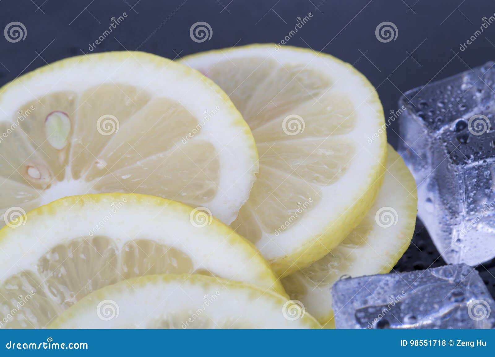 Ice cubes and lemon slices stock photo. Image of food - 98551718