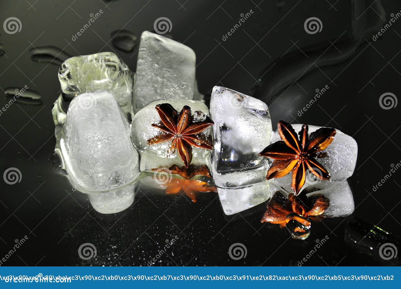 Ice Cubes on a Mirror Surface and Aniseed Stars. Stock Photo - Image of ...