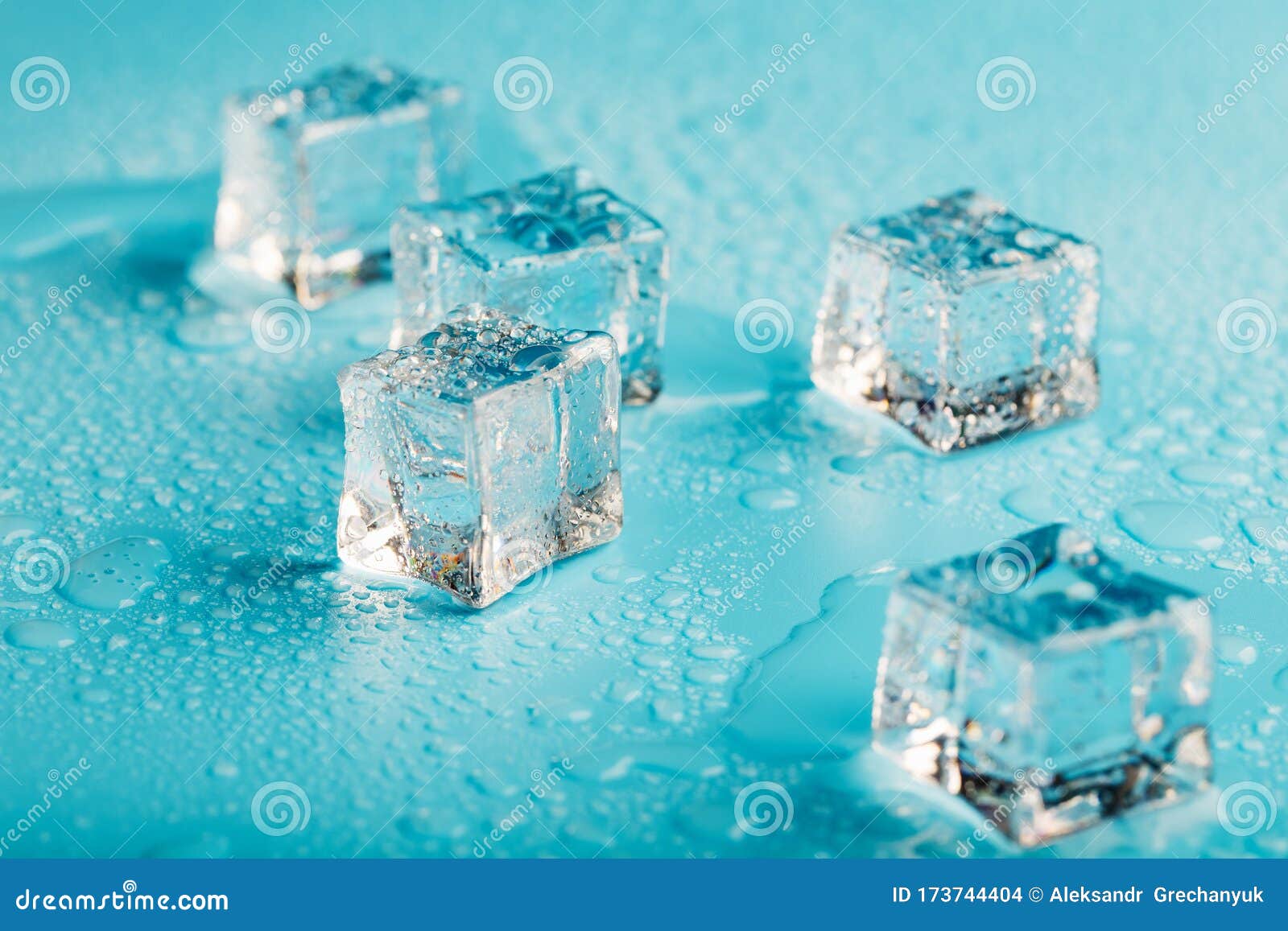 Ice Cubes are Scattered with Water Drops Scattered on a Blue Background ...