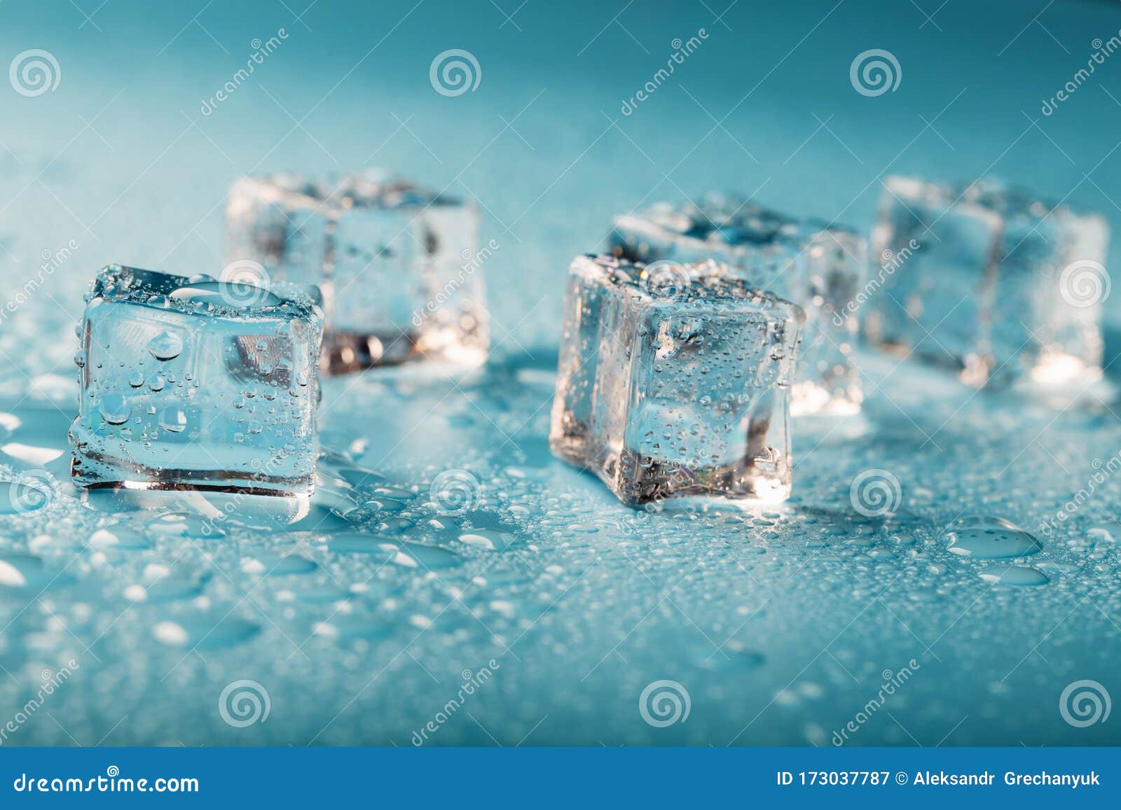 Ice Cubes are Scattered with Water Drops Scattered on a Blue Background ...