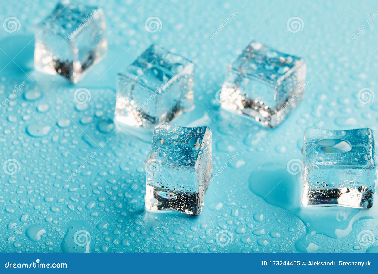 Ice Cubes are Scattered with Water Drops Scattered on a Blue Background ...
