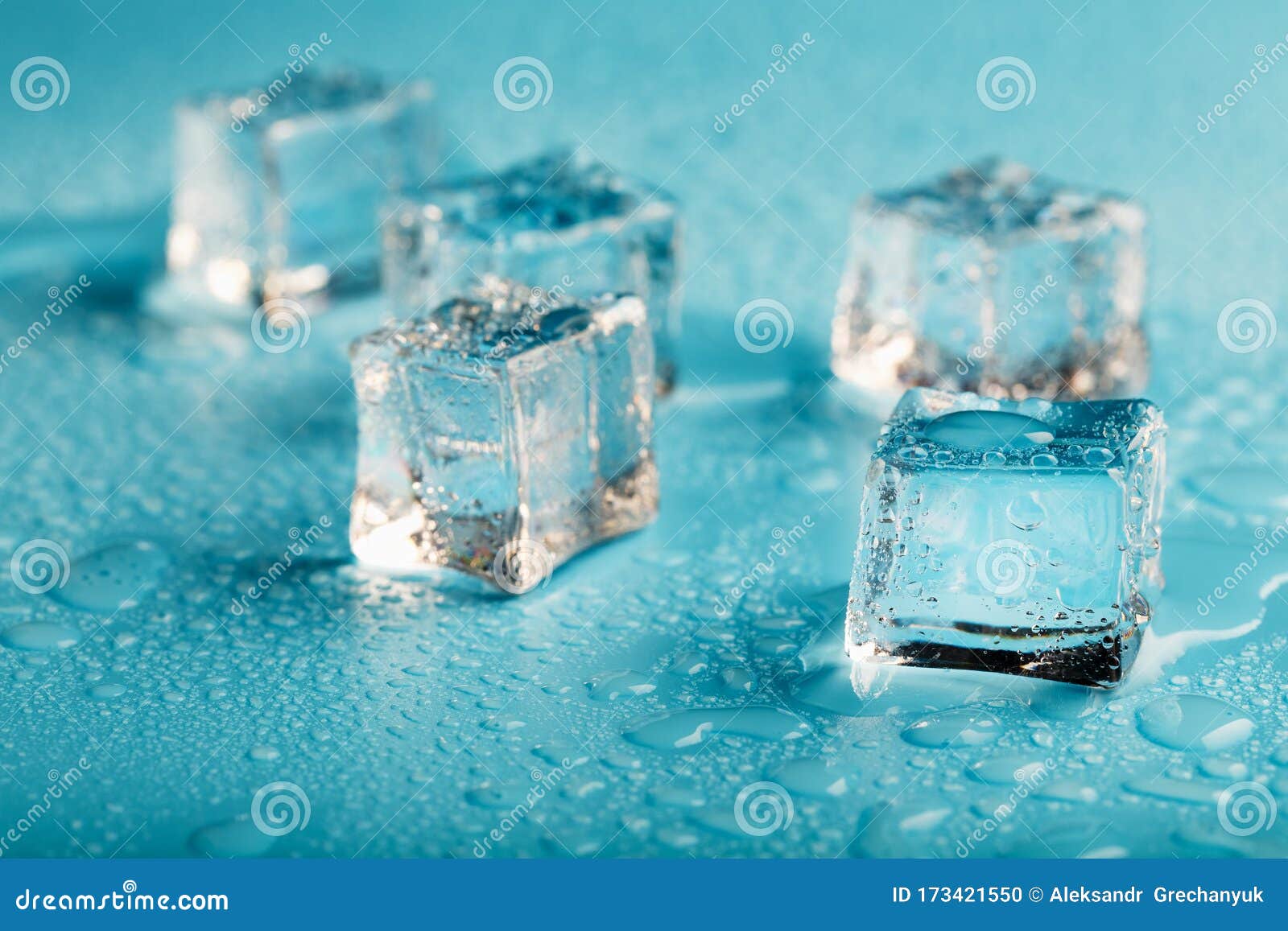 Ice Cubes are Scattered with Water Drops Scattered on a Blue Background ...