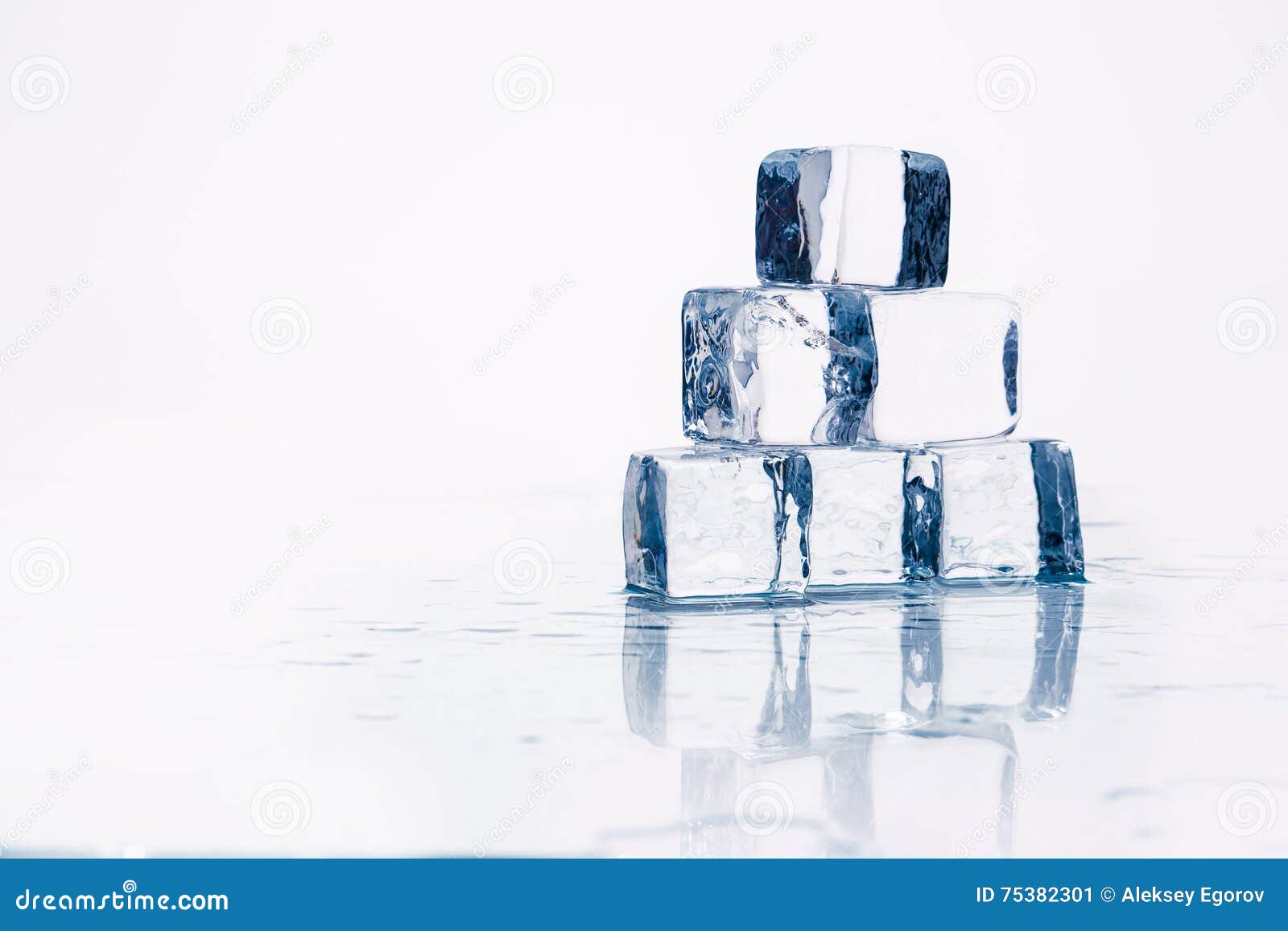Ice cubes on table stock image. Image of cold, tower - 75382301