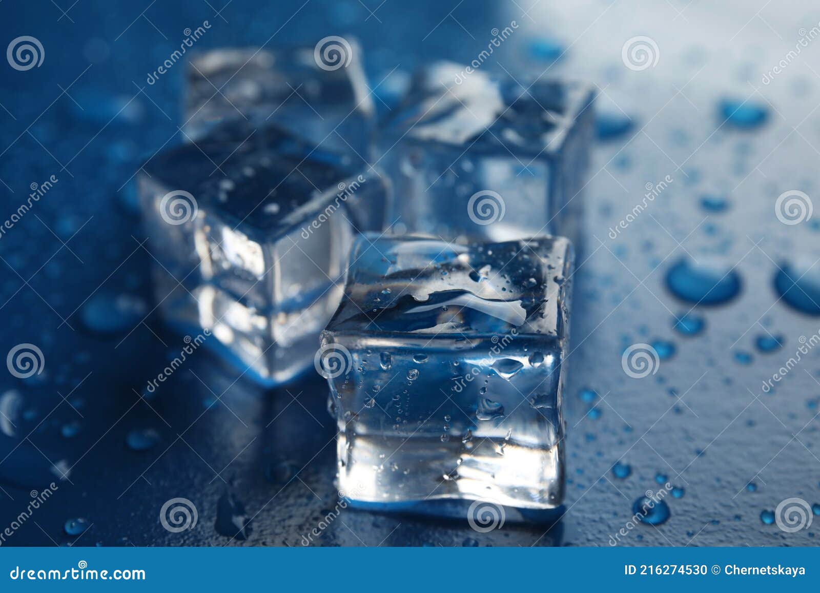 Ice Cubes with Water Drops on Blue Background, Closeup Stock Photo ...