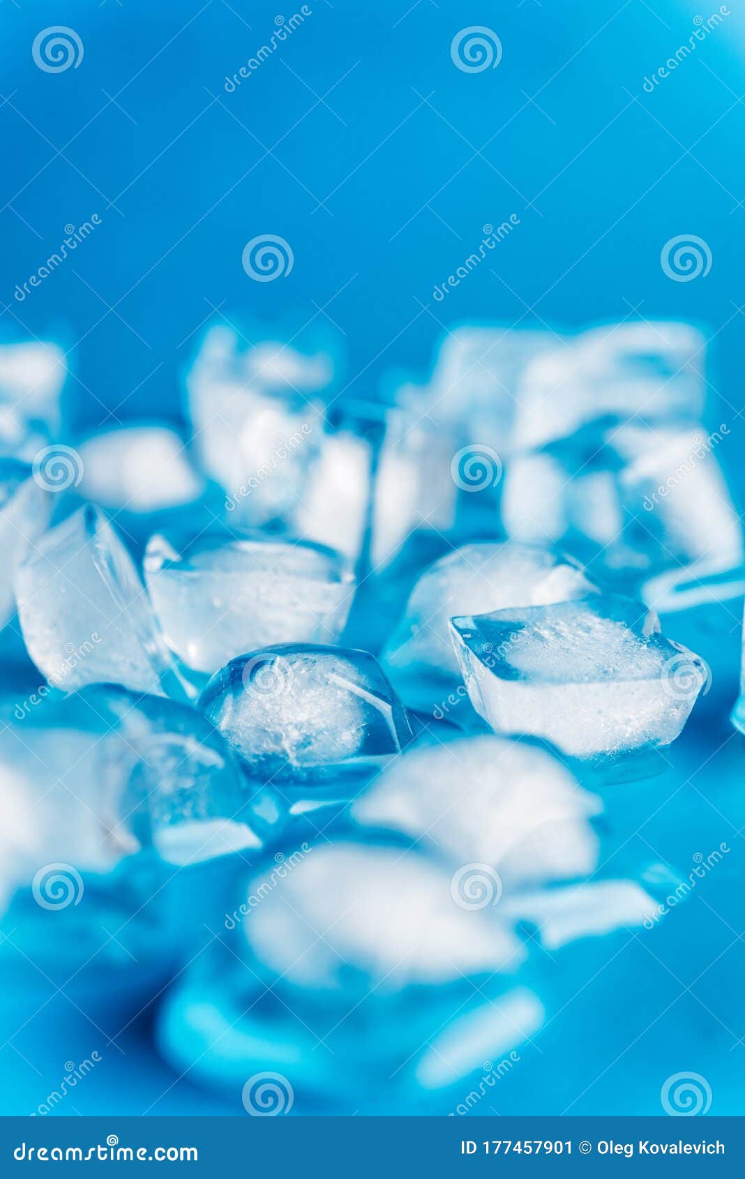 Ice Cubes and Water Drops Scattered on Blue Background Stock Image ...