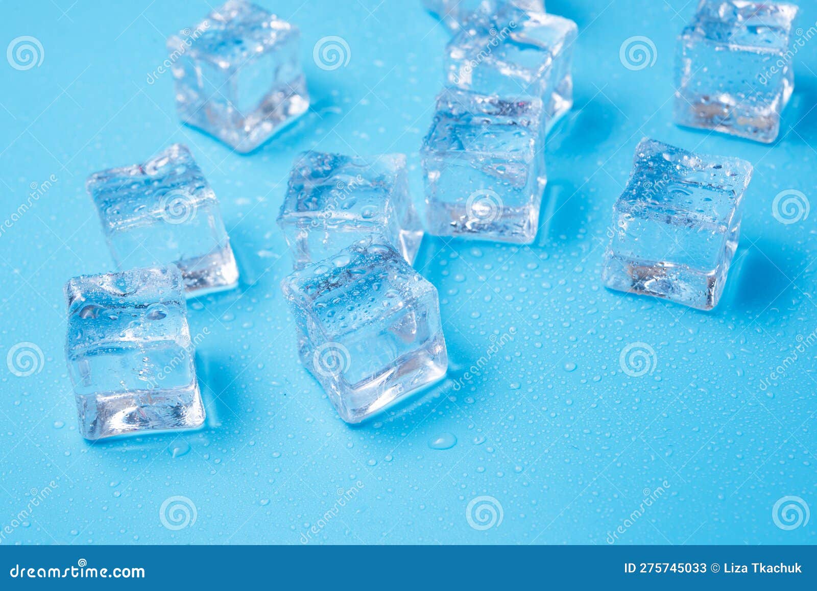 Ice Cubes with Water Drops Scattered on a Blue Background, Top View ...