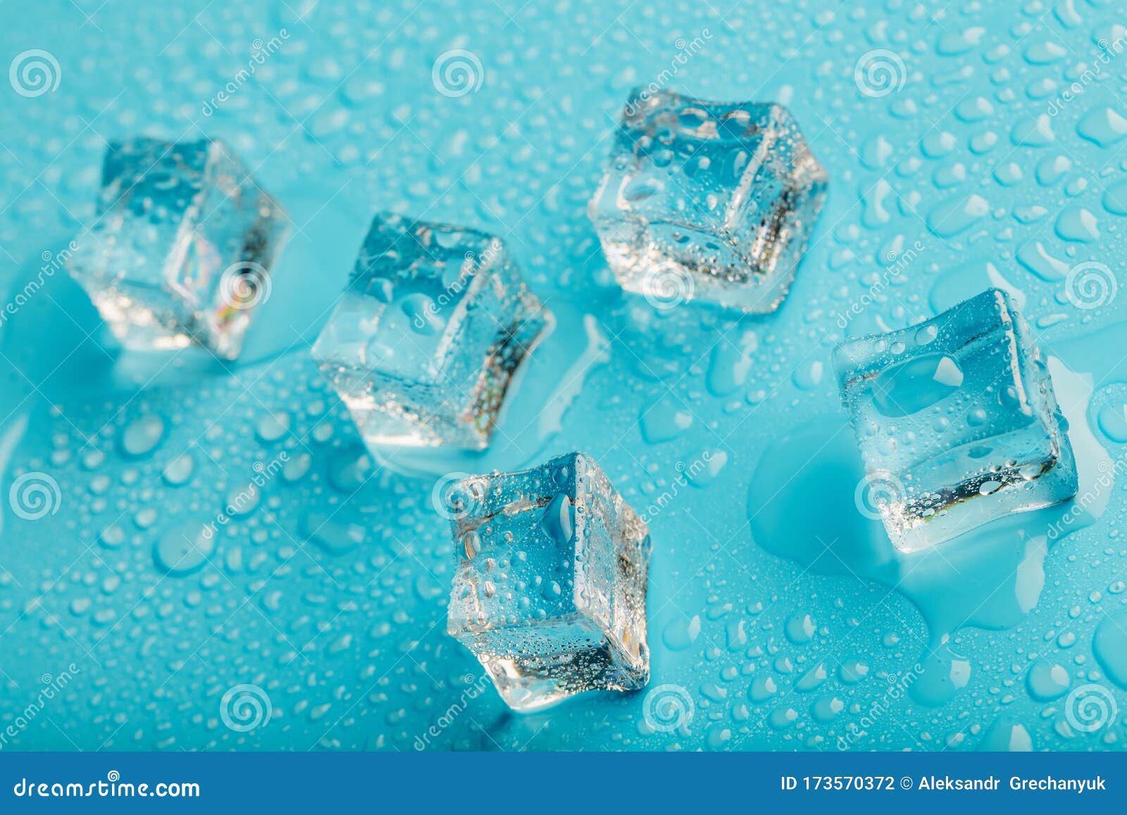 Ice Cubes with Water Drops Scattered on a Blue Background, Top View ...