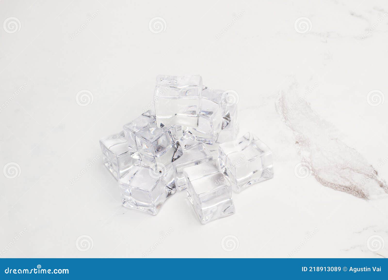 Ice Cubes on a White and Gray Marble Table Stock Image - Image of color ...