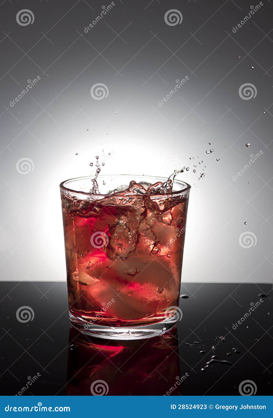 Ice dropping into drink. stock image. Image of drink - 28524923