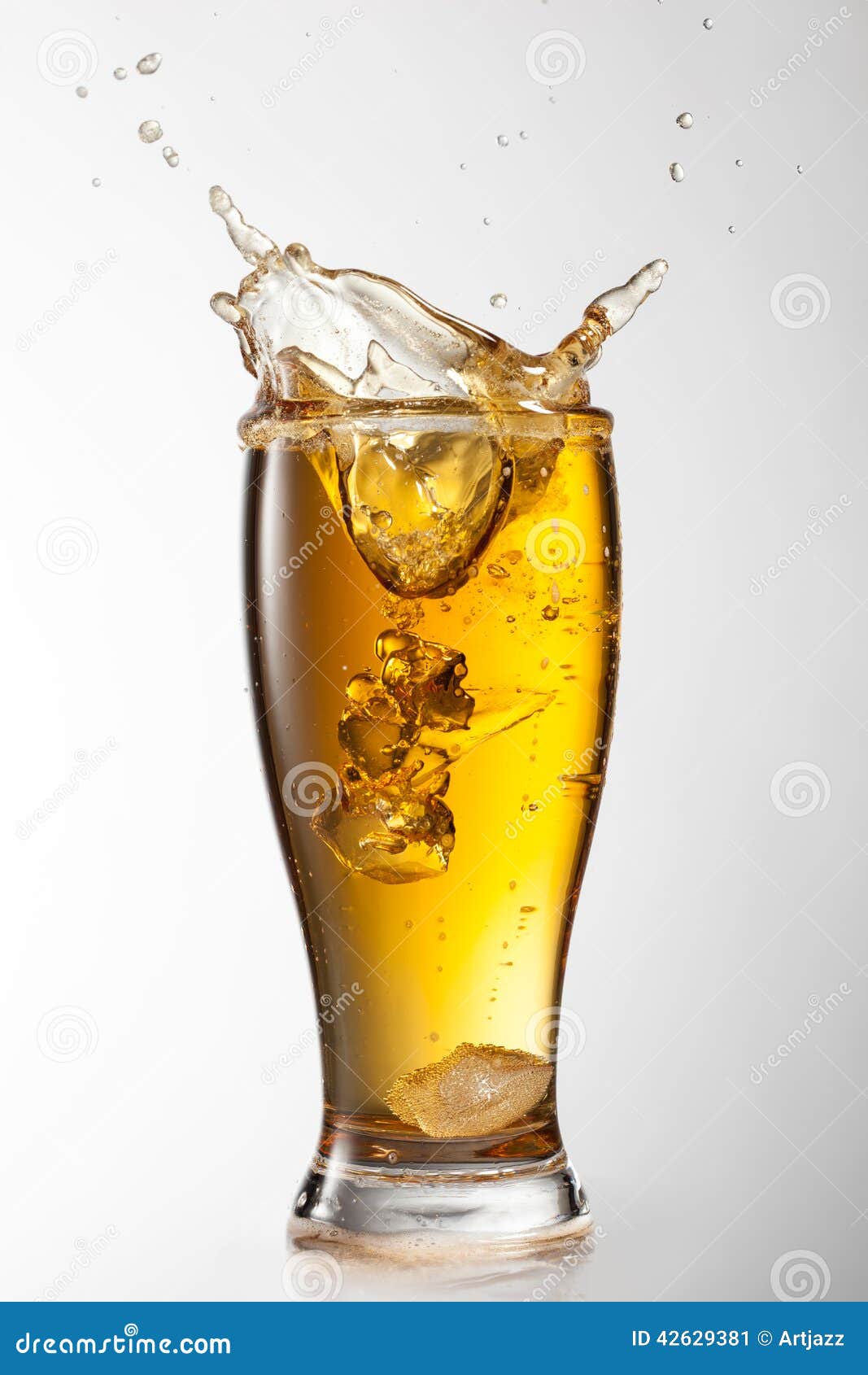 Ice Falling into Beer Glass with Splash Isolated Stock Image - Image of ...