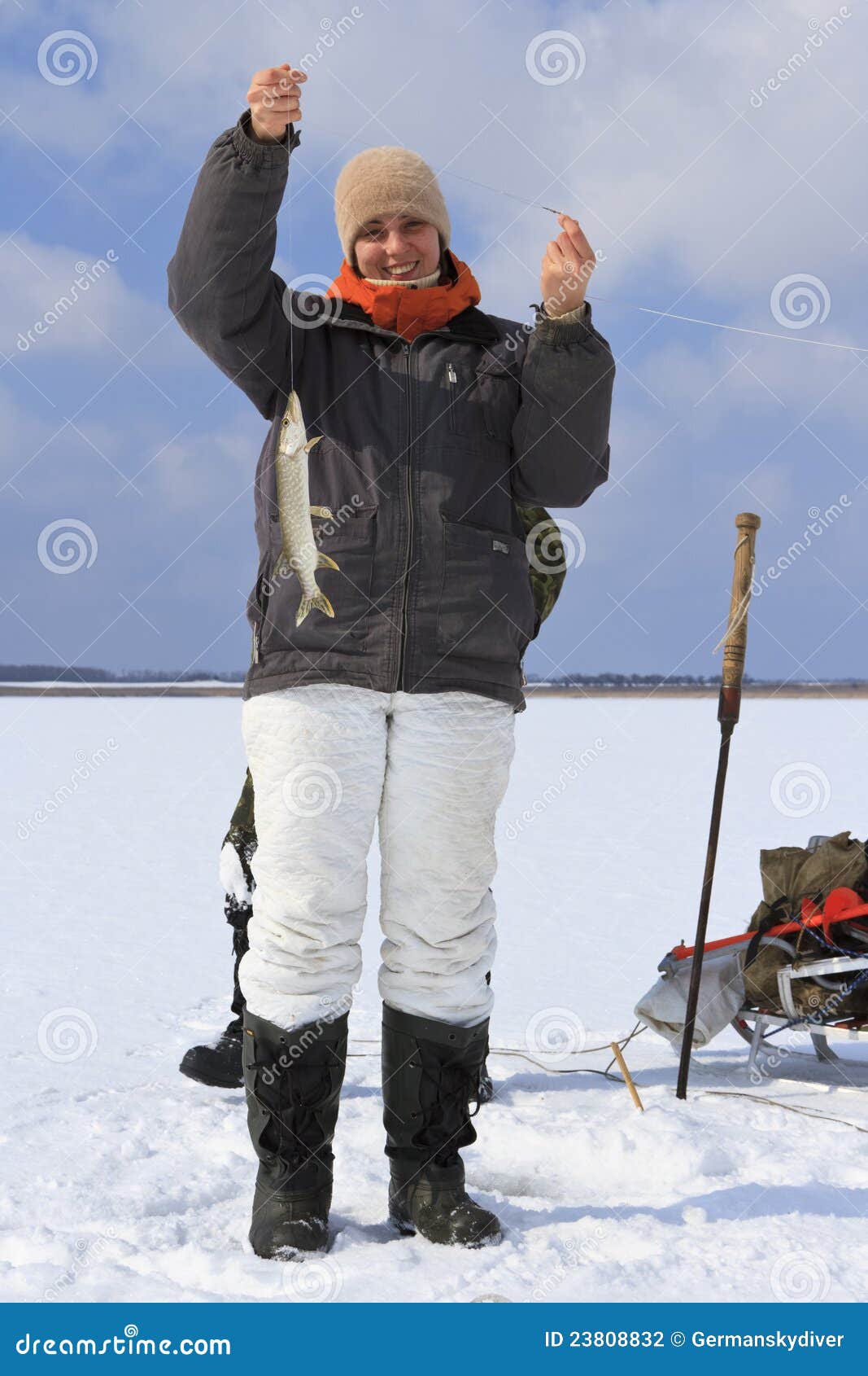 Ice Fishing. stock photo. Image of water, ladle, success - 23808832