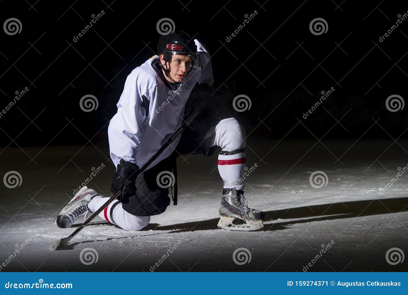 Ice Hockey Player in Action Kicking with Stick Stock Image - Image of ...