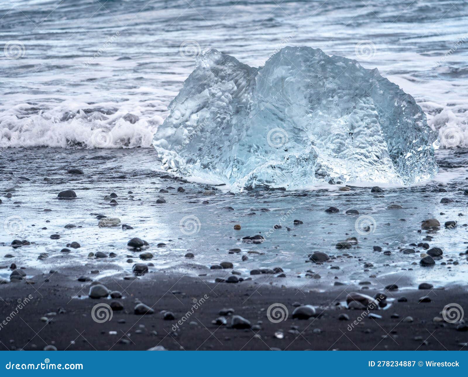 Ice Melting Off a Rock at the Diamond Beach by the Ocean Stock Image ...