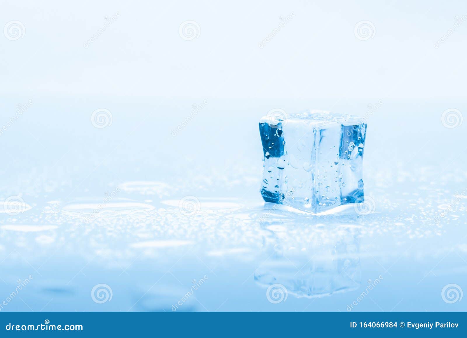 Ice One Cube Square with Drops Water Clean on Blue Background Stock ...