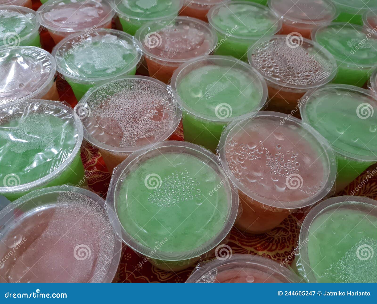 Ice in Red and Green Colored Plastic Cups Stock Image - Image of ...
