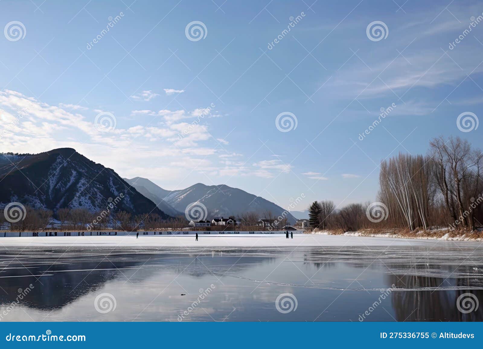 Ice Rink on Frozen River with View of Distant Mountain Range Stock ...