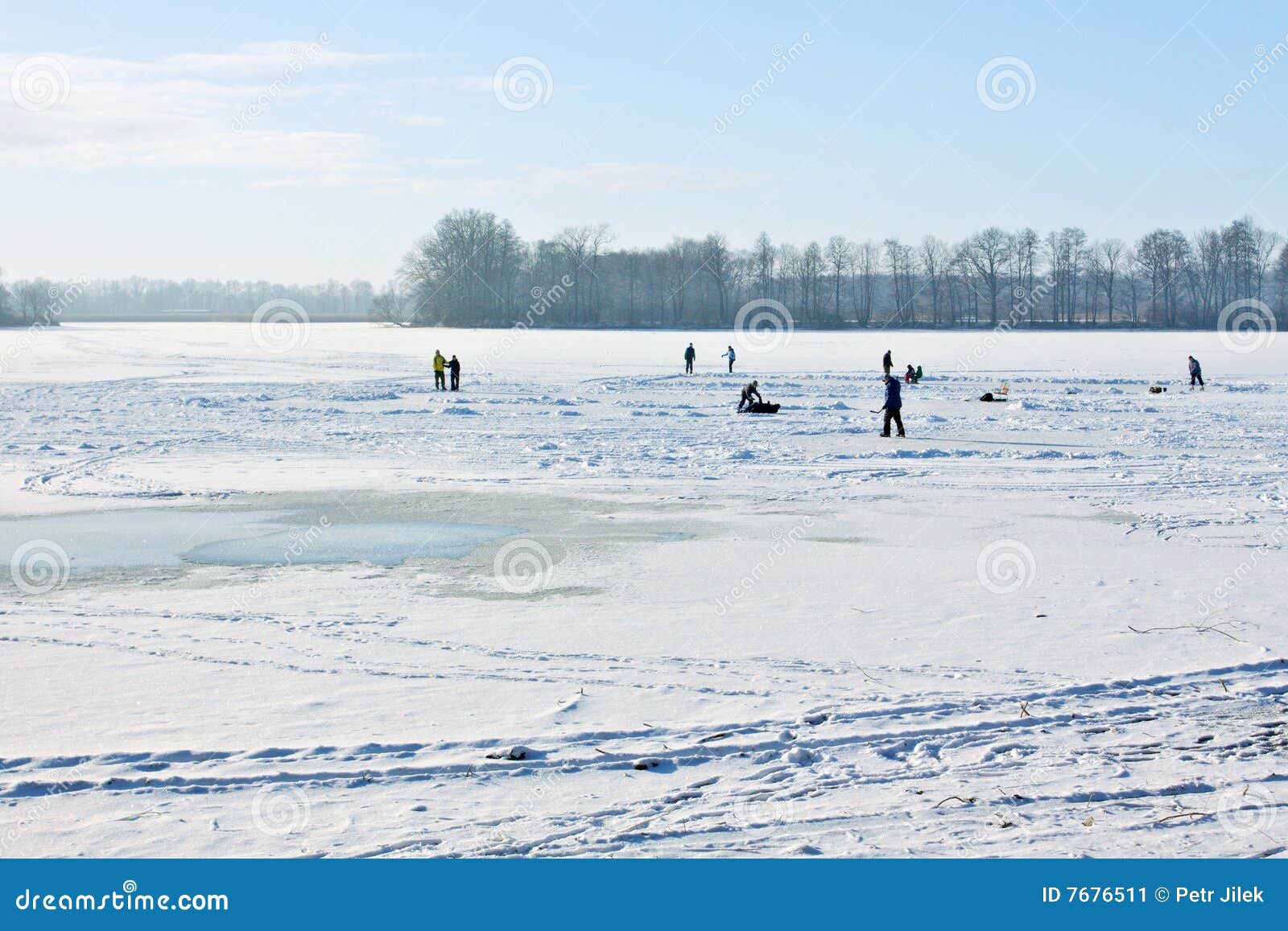 Ice-skating on frozen lake stock image. Image of black - 7676511