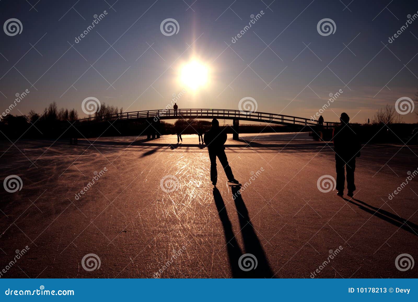 Ice Skating at Sunset in the Netherlands Stock Image - Image of skate ...