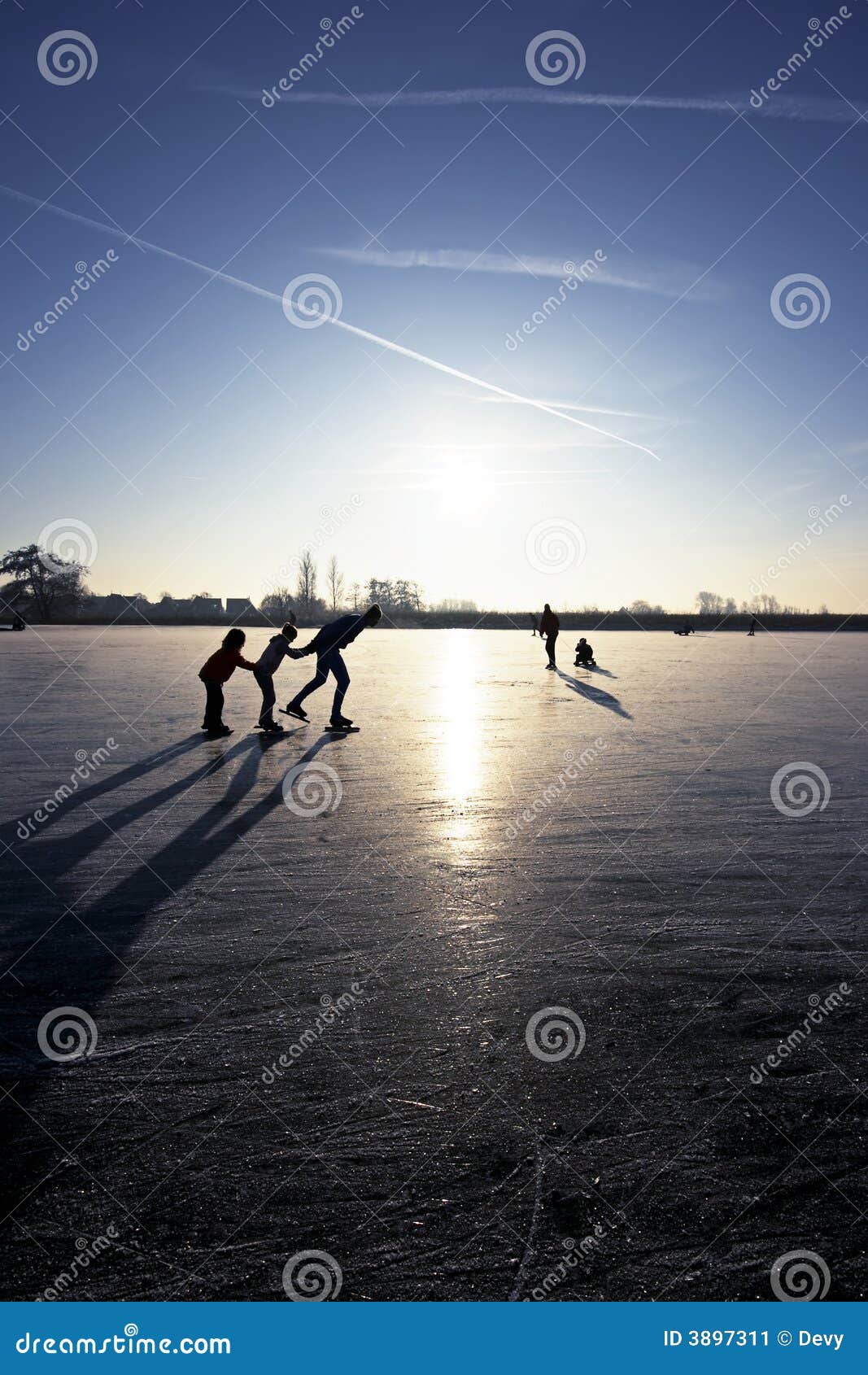 Ice Skating at Sunset in the Netherlands Stock Image - Image of ...