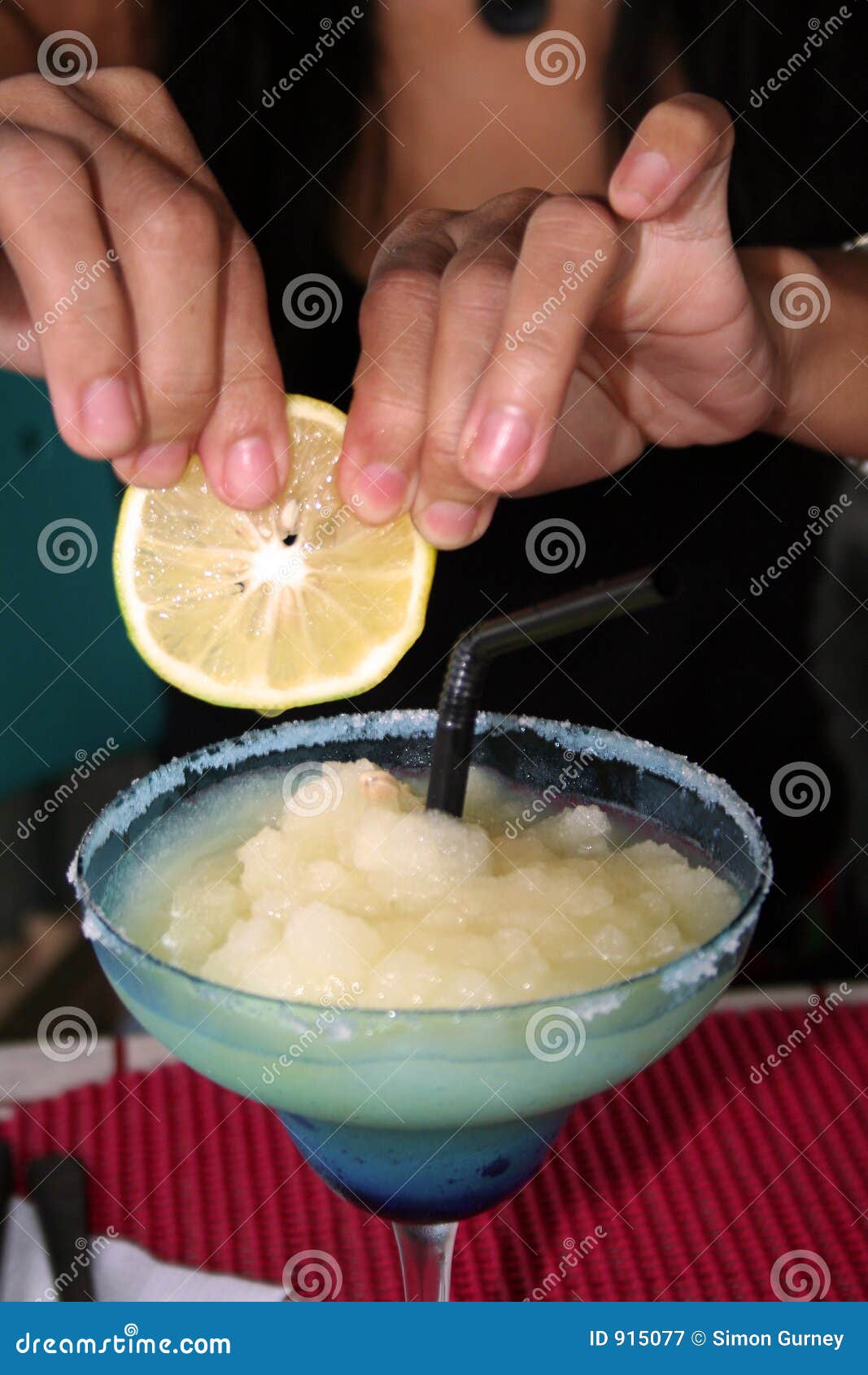 Ice and a Slice Frozen Cocktail Squeezing Lemon Stock Image - Image of ...