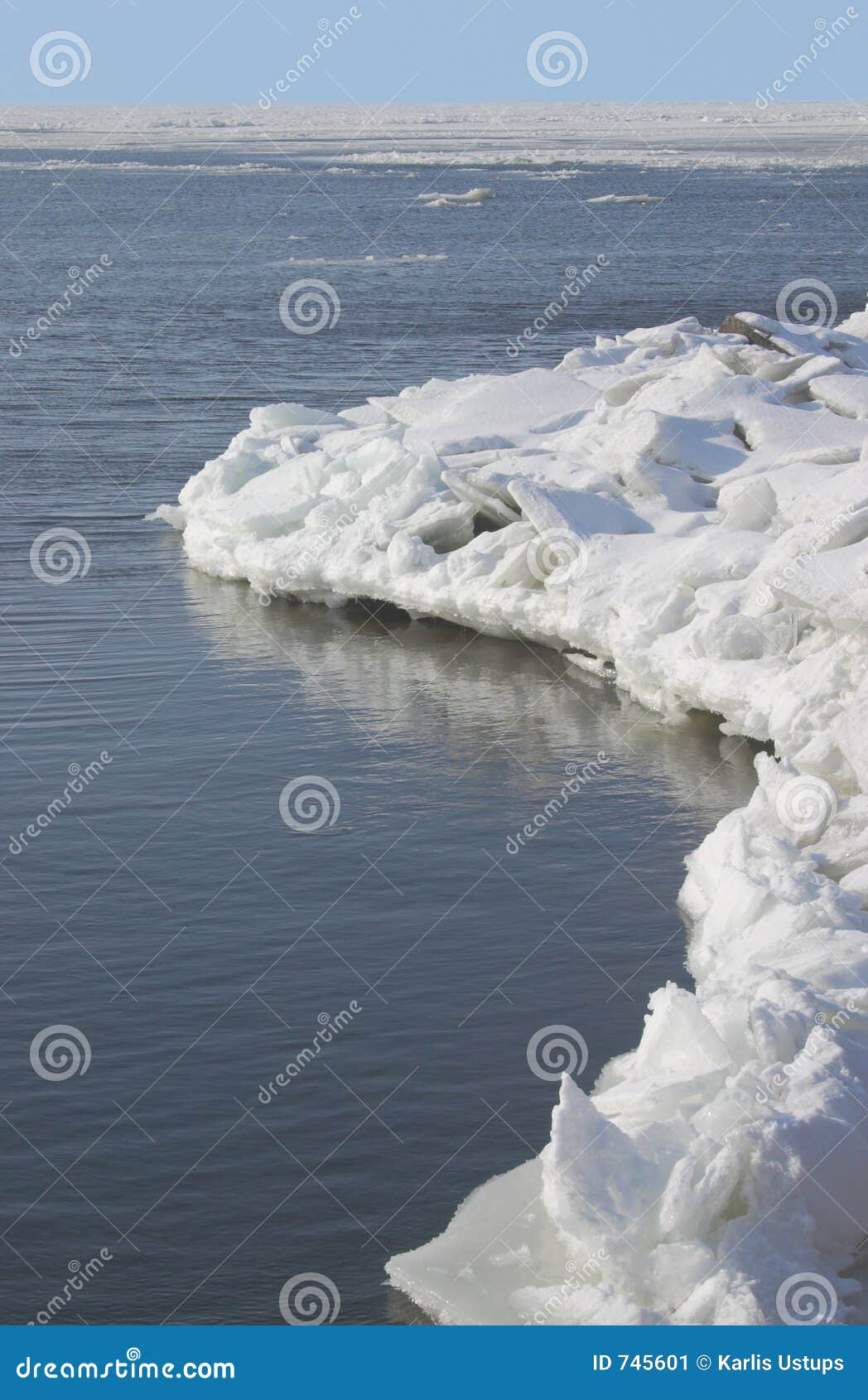 Ice/Snow heap in the sea stock image. Image of water, reflection - 745601