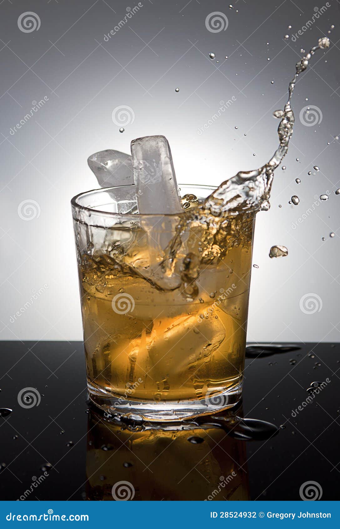 Ice splashes into drink. stock photo. Image of quench - 28524932