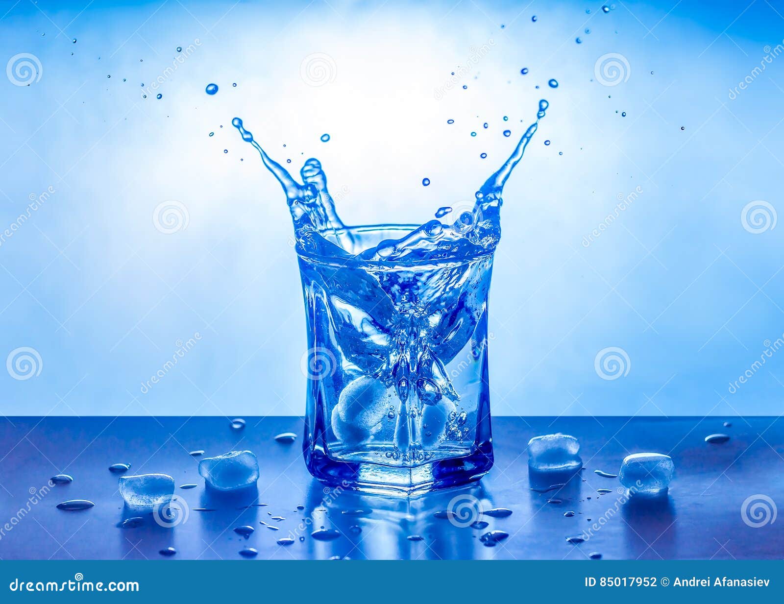 Ice Splashing in a Cool Glass of Water Stock Photo - Image of bubbles ...