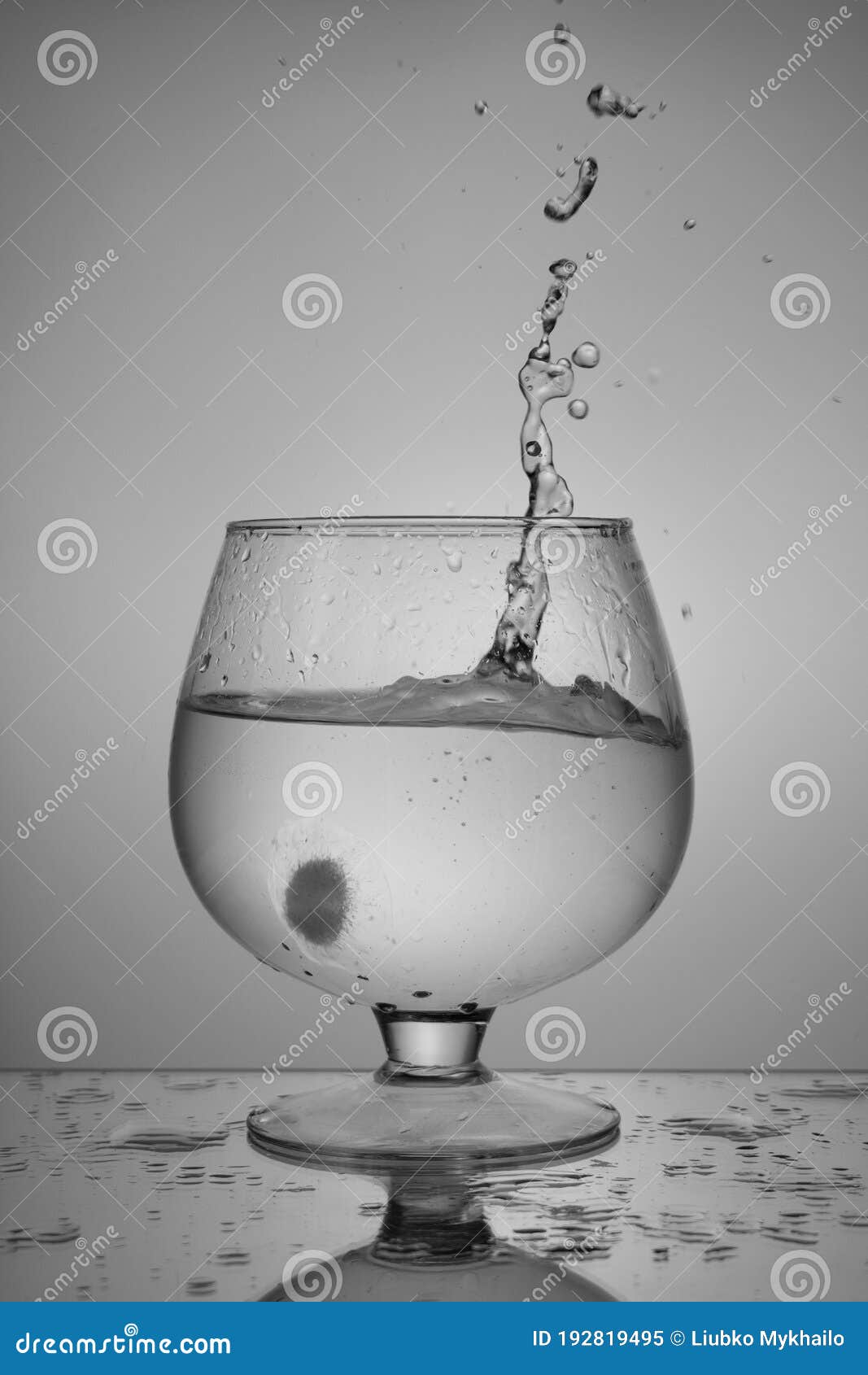 Ice is Thrown into the Glass. Then a Lot of Bubbles and Splashes Formed ...